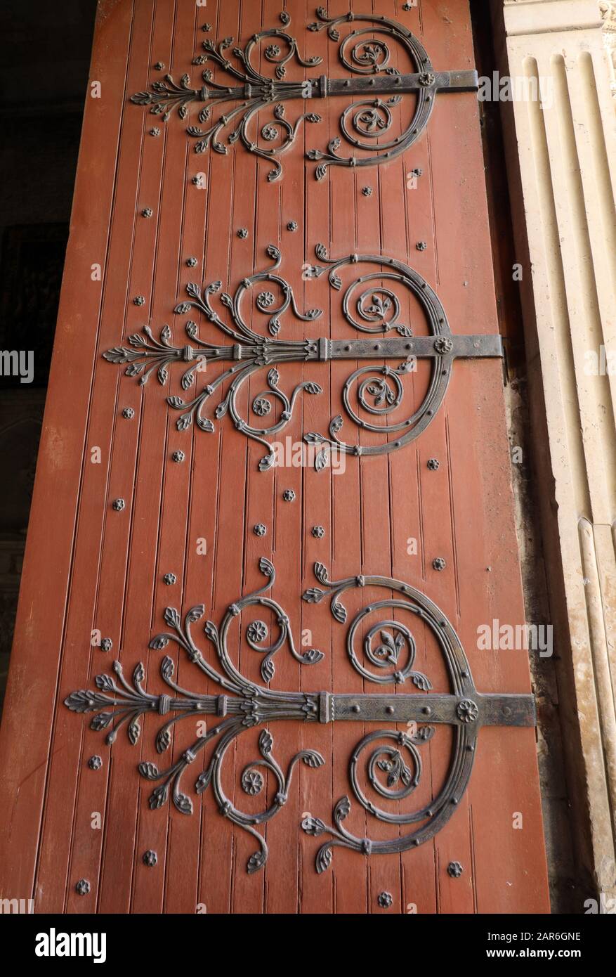 Arles, France - June 27, 2017: Decorated hinges in the door of Saint ...