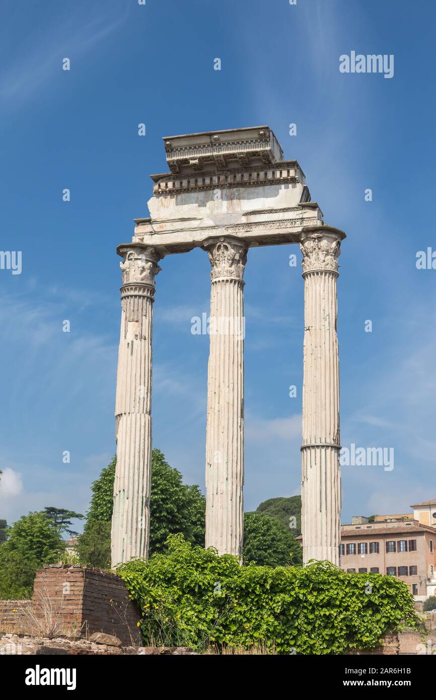 Front view of ruins of the iconic three columns in Forum Romanum. Rome ...