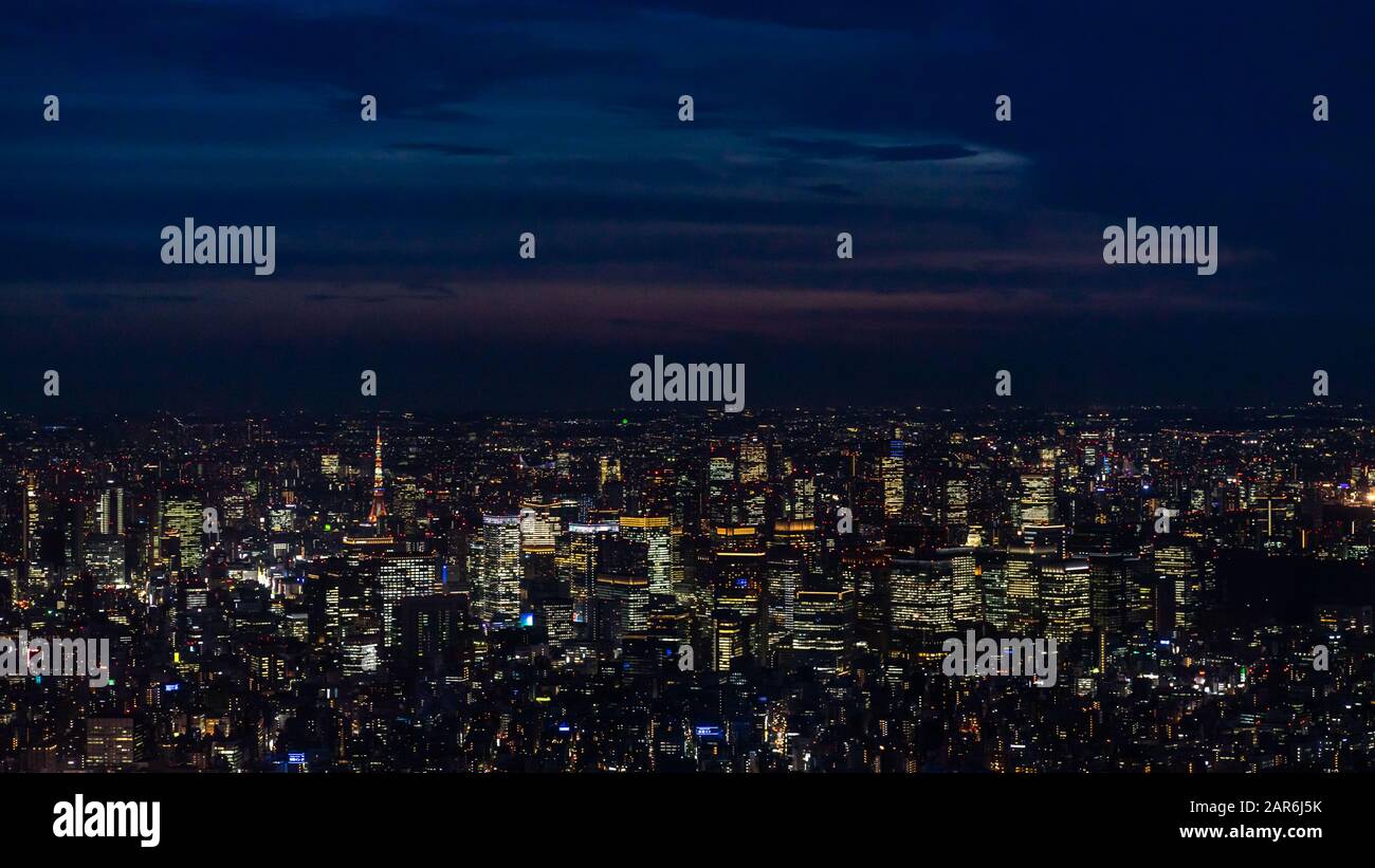 Panoramic view of Tokyo from Skytree tv tower observation deck with skyscrapers illuminated at ...