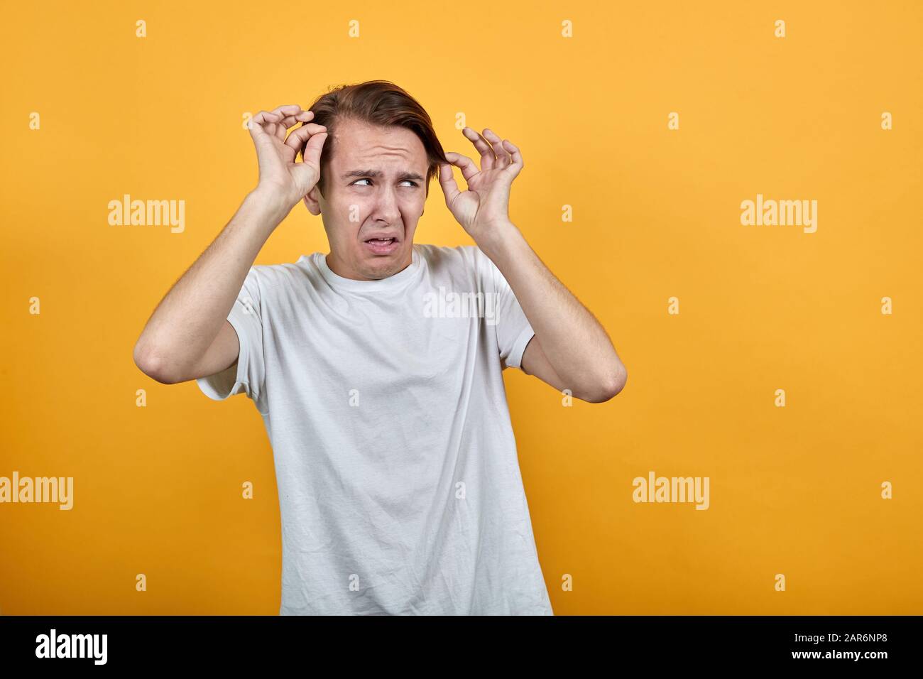 Handsome man with a haircut barber shop discontent Stock Photo - Alamy