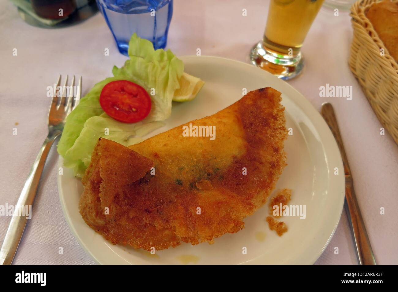Brik, a typical Tunisian traditional food. Stuffed with egg and usually ...