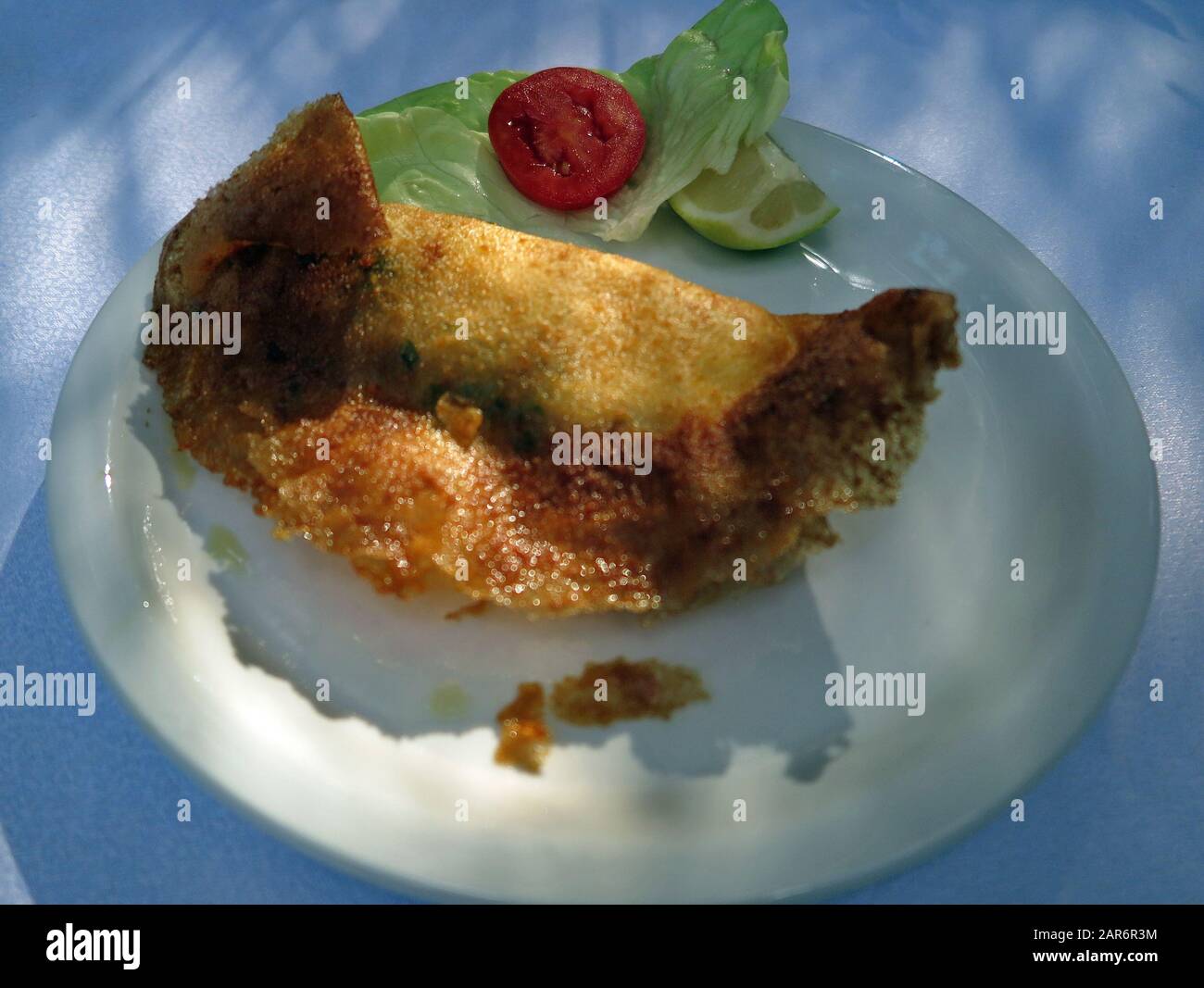 Brik, a typical Tunisian traditional food. Stuffed with egg and usually ...