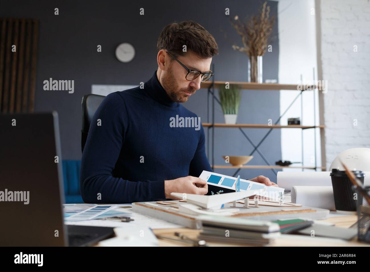 Architect working in office with color palette. Engineer select colors ...