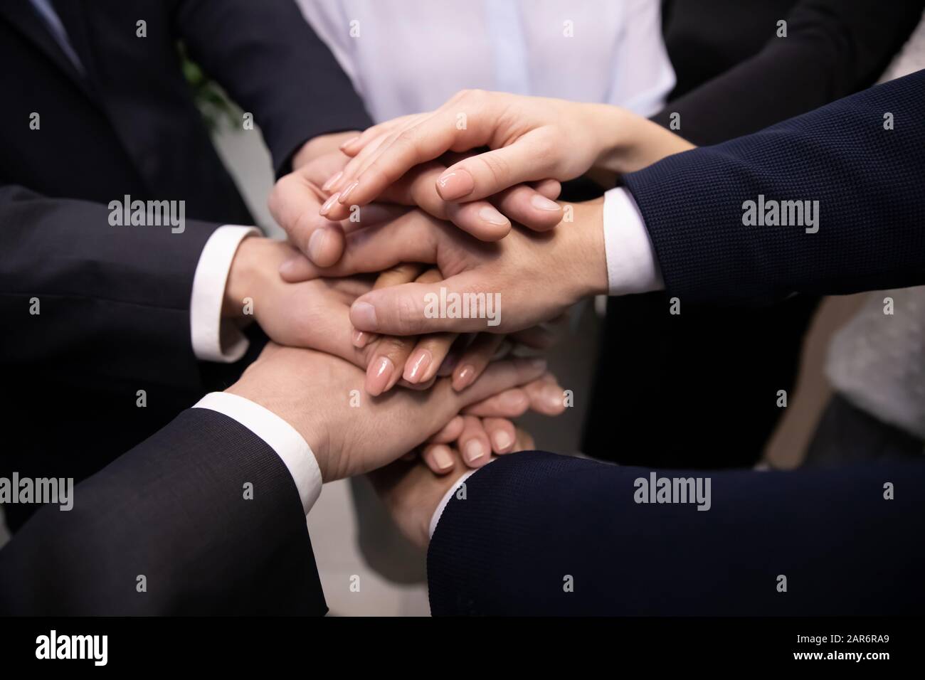Teammates hands together hi-res stock photography and images - Alamy