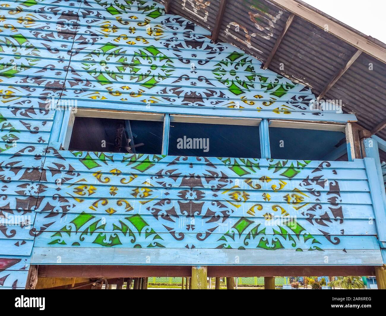 Dayak Lundayeh traditional house with tribal painting. Dayak is native ...