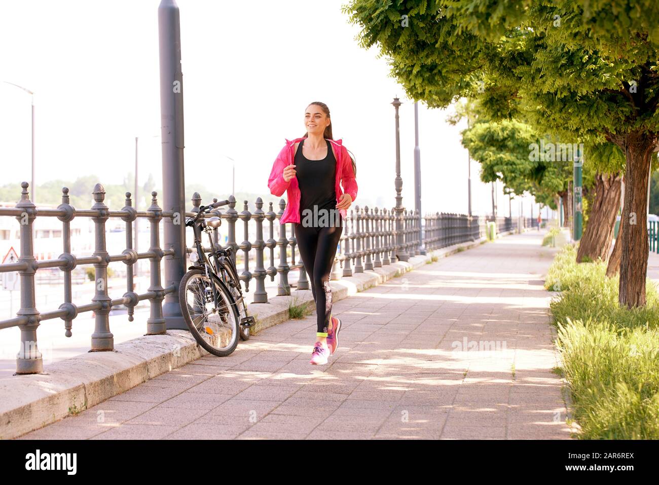 Attractive woman running in morning hi-res stock photography and images ...