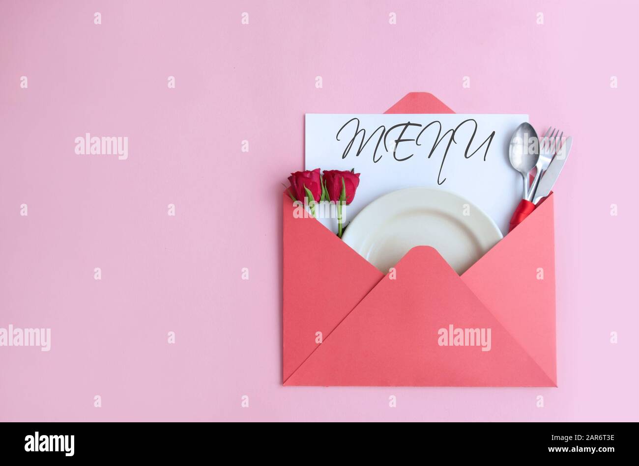 Valentines day meal menu, plate with cutlery and two red roses inside ...