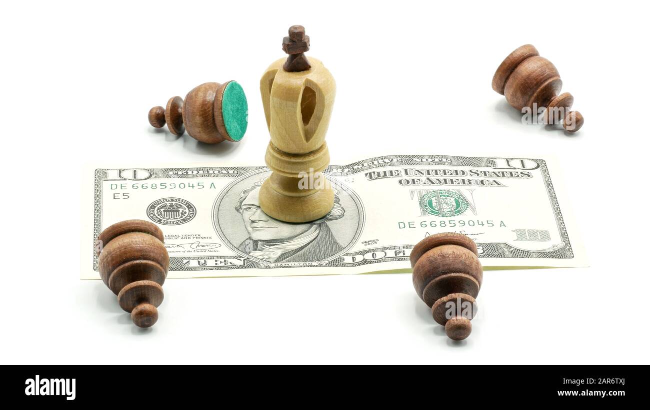 Money Rules: Four Defeated Black Pawn Chess Pieces Lying Around A White ...