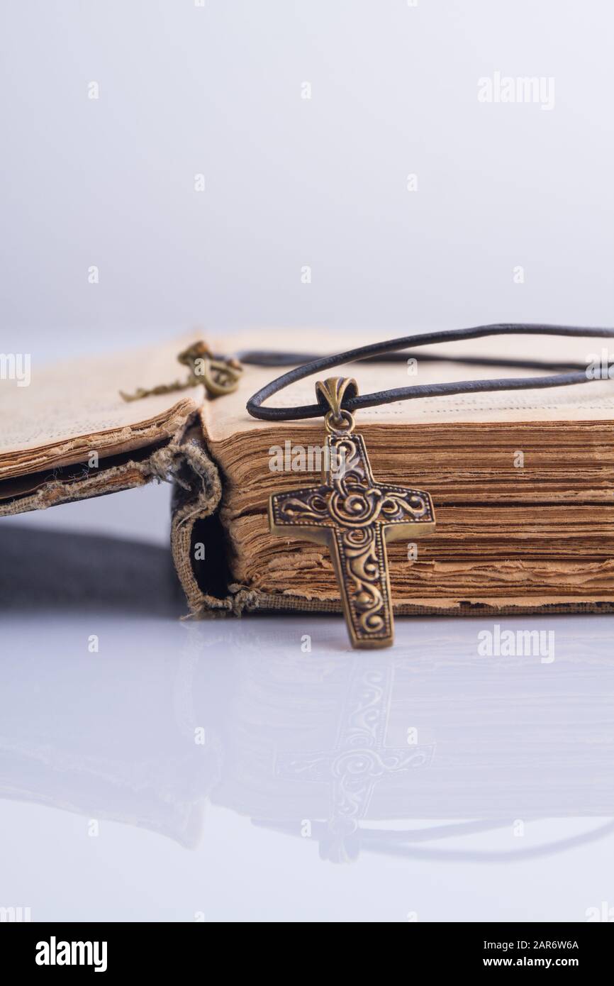 Decorated copper christ on an aged bible Stock Photo - Alamy