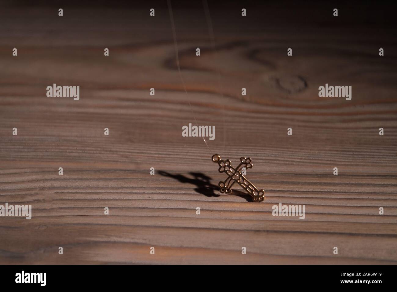 Ornamental golden cross with shadow Stock Photo - Alamy