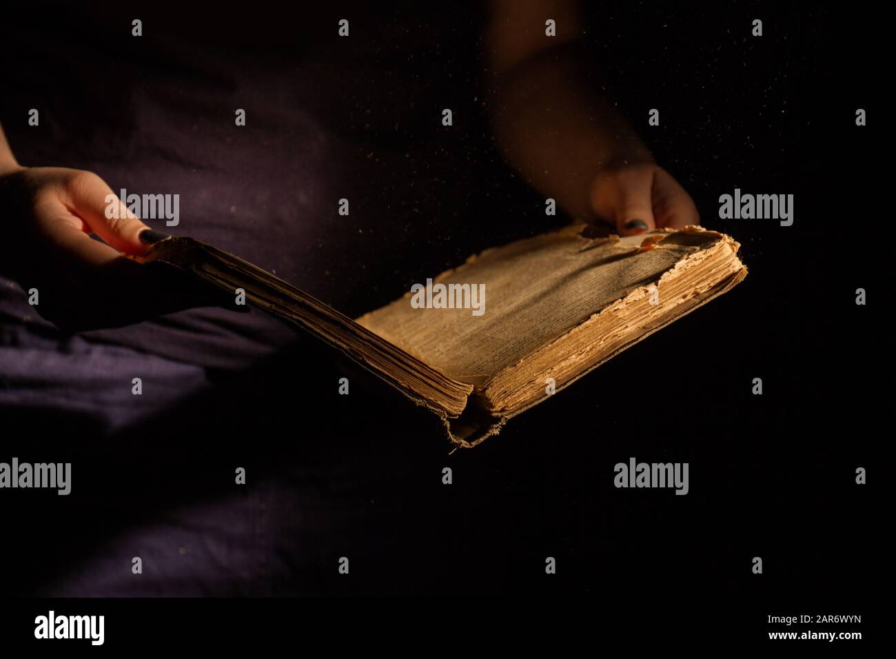 Woman's reading old vintage worn book Stock Photo - Alamy