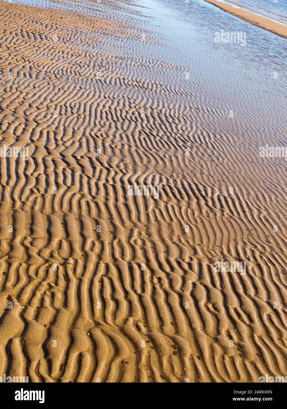 beautiful sand texture of wind, water and sand Stock Photo - Alamy