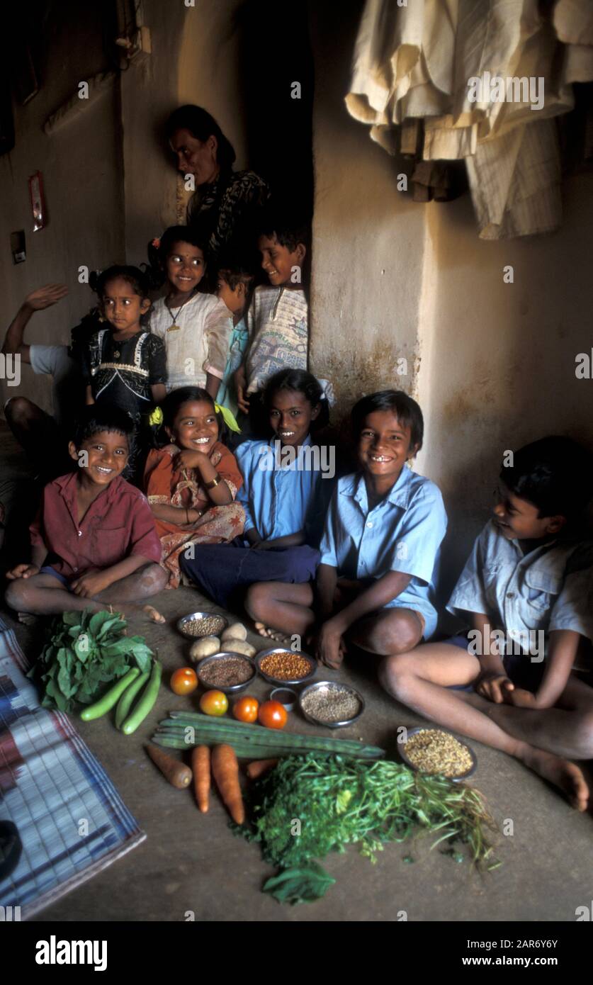 INDIA Children with healthy vegetables and traditional seeds of horse ...