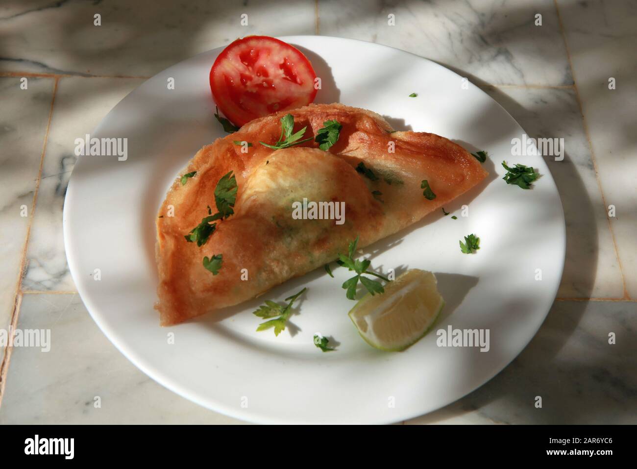"Brik" traditionell food portion on plate at restaurant. A Tunisian ...