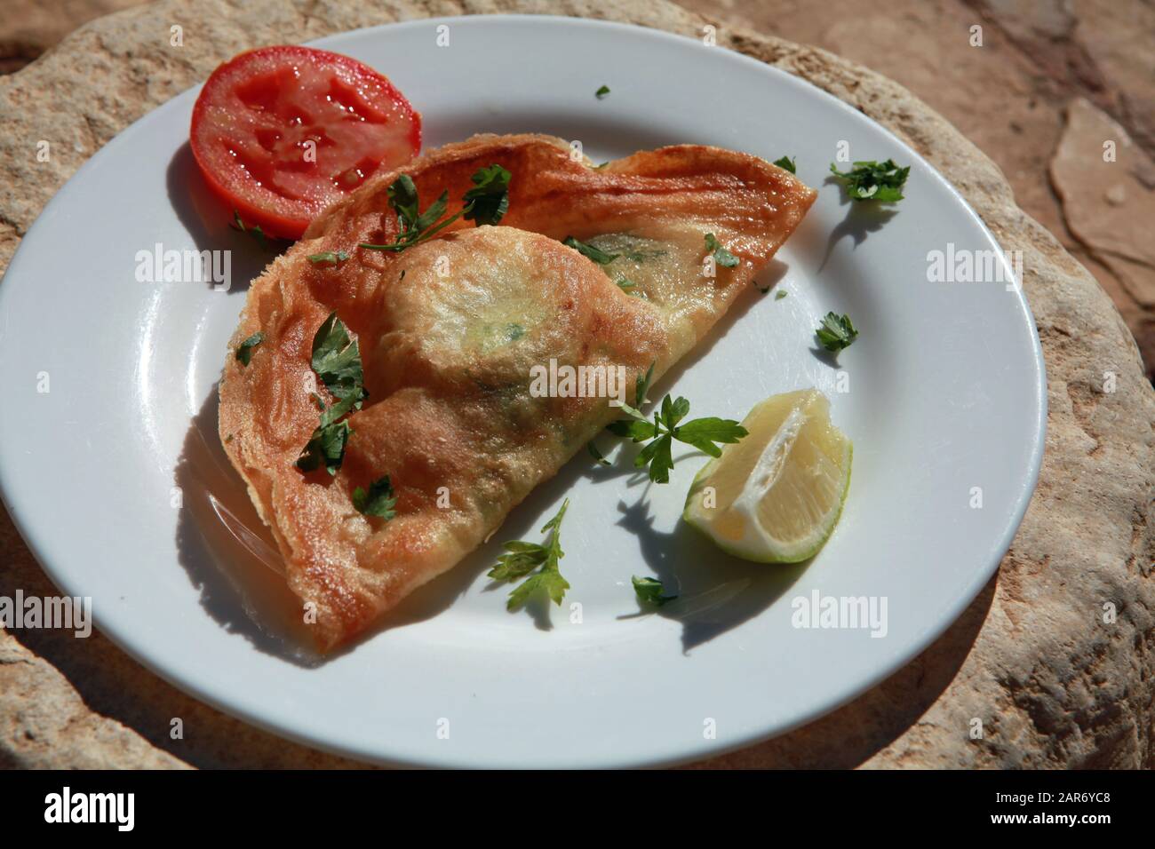 "Brik" traditionell food portion on plate at restaurant. A Tunisian ...