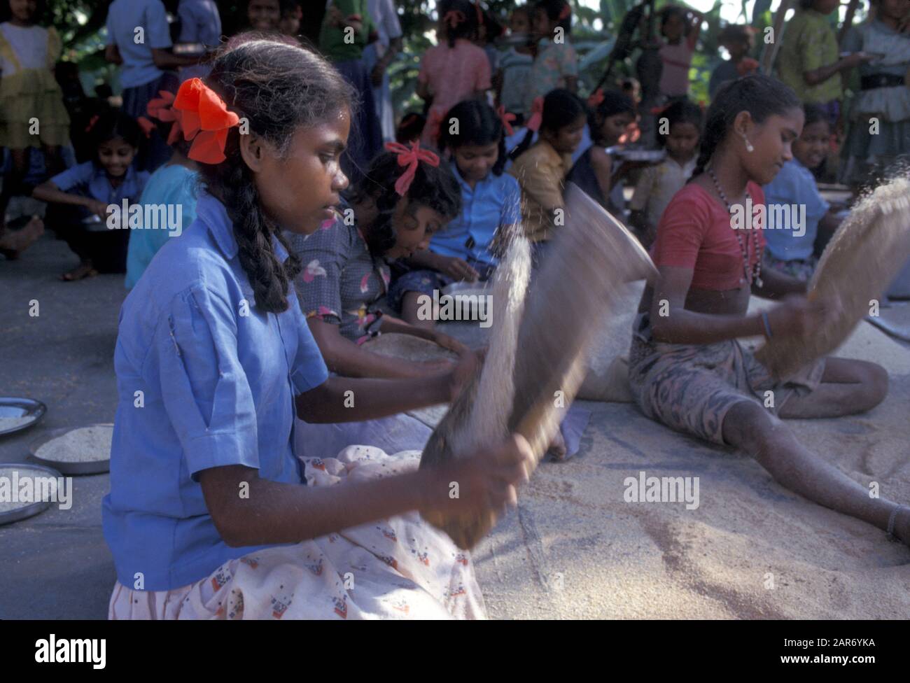 India Girls cleaning rice, Tamil Nadu Stock Photo - Alamy