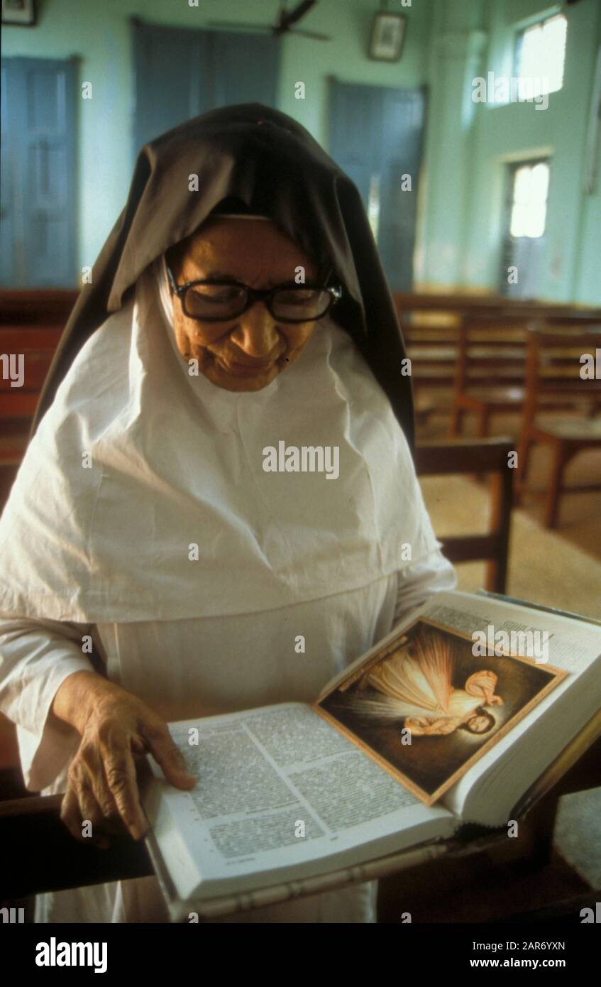 India Nun reading bible, Kerala Stock Photo - Alamy