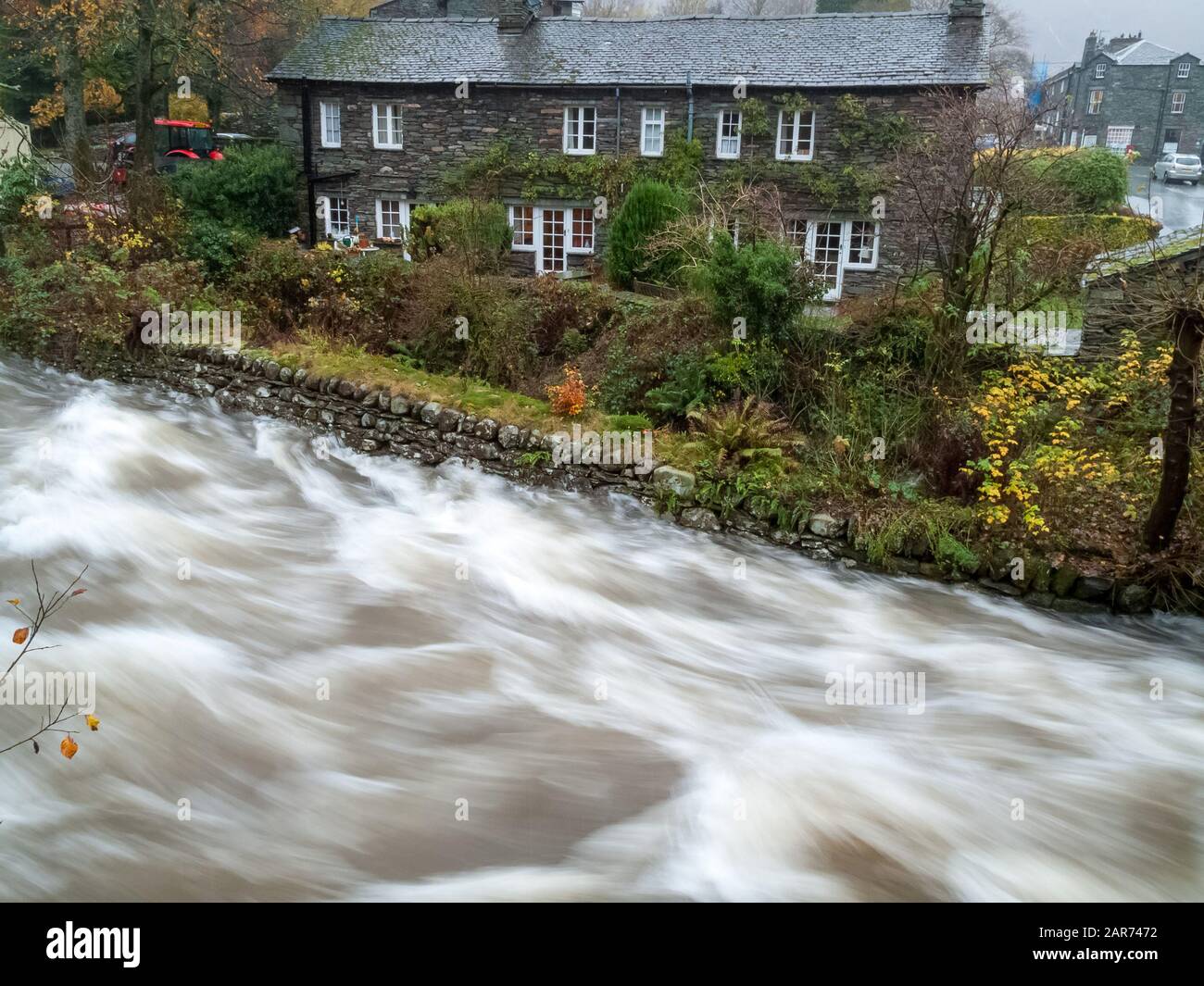 The fast flowing Great Langdale Beck in spate following heavy rain ...