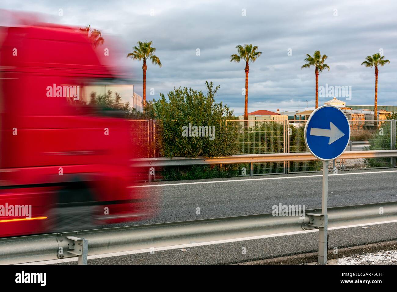 Mandatory traffic sign and truck moving in the same direction Stock ...