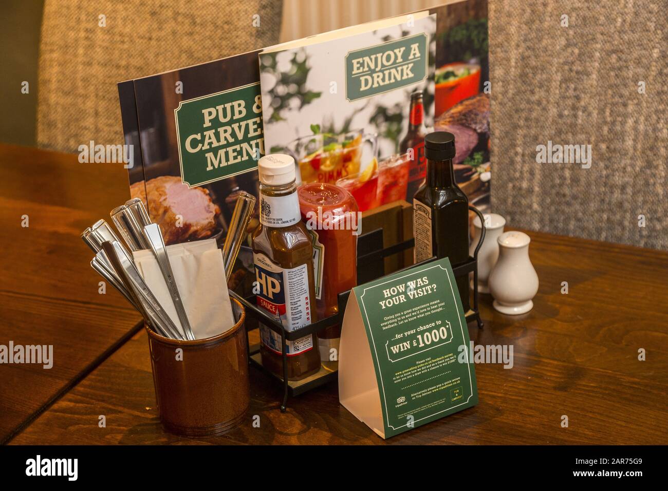 Table setting in a Greene King pub, Engine House, Torquay, part of the ...