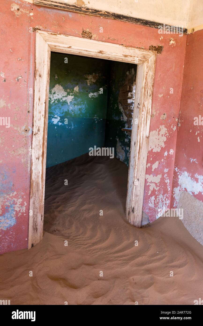 Abandoned and forgotten building and room being taken over by encroaching sandstorm, Kolmanskop ...