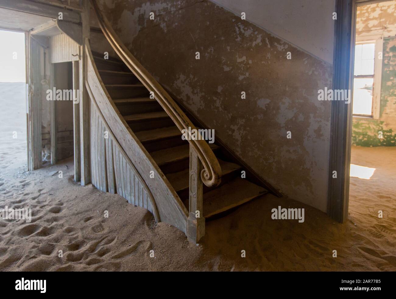 Abandoned and forgotten building and room being taken over by encroaching sandstorm, Kolmanskop ...