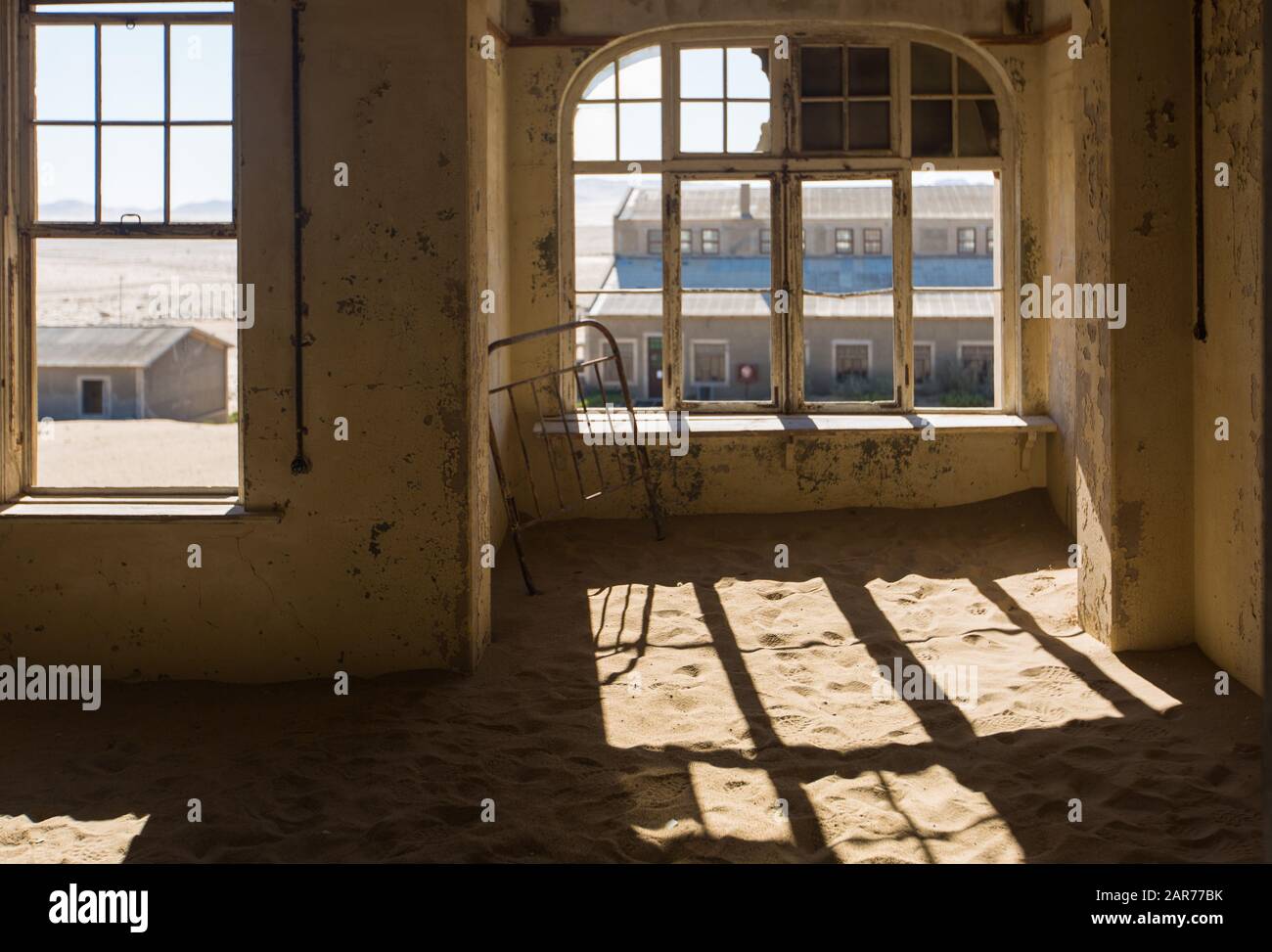 Abandoned and forgotten building and room being taken over by encroaching sandstorm, Kolmanskop ...