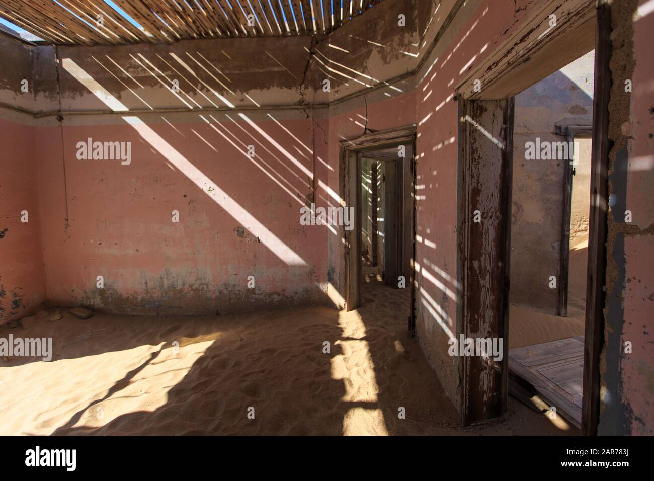 Abandoned and forgotten building and room being taken over by encroaching sandstorm, Kolmanskop ...