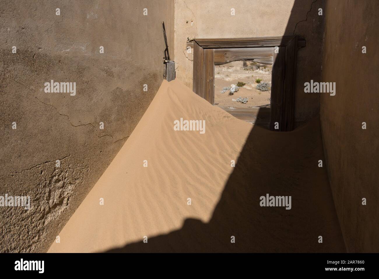 Abandoned and forgotten building and room being taken over by encroaching sandstorm, Kolmanskop ...