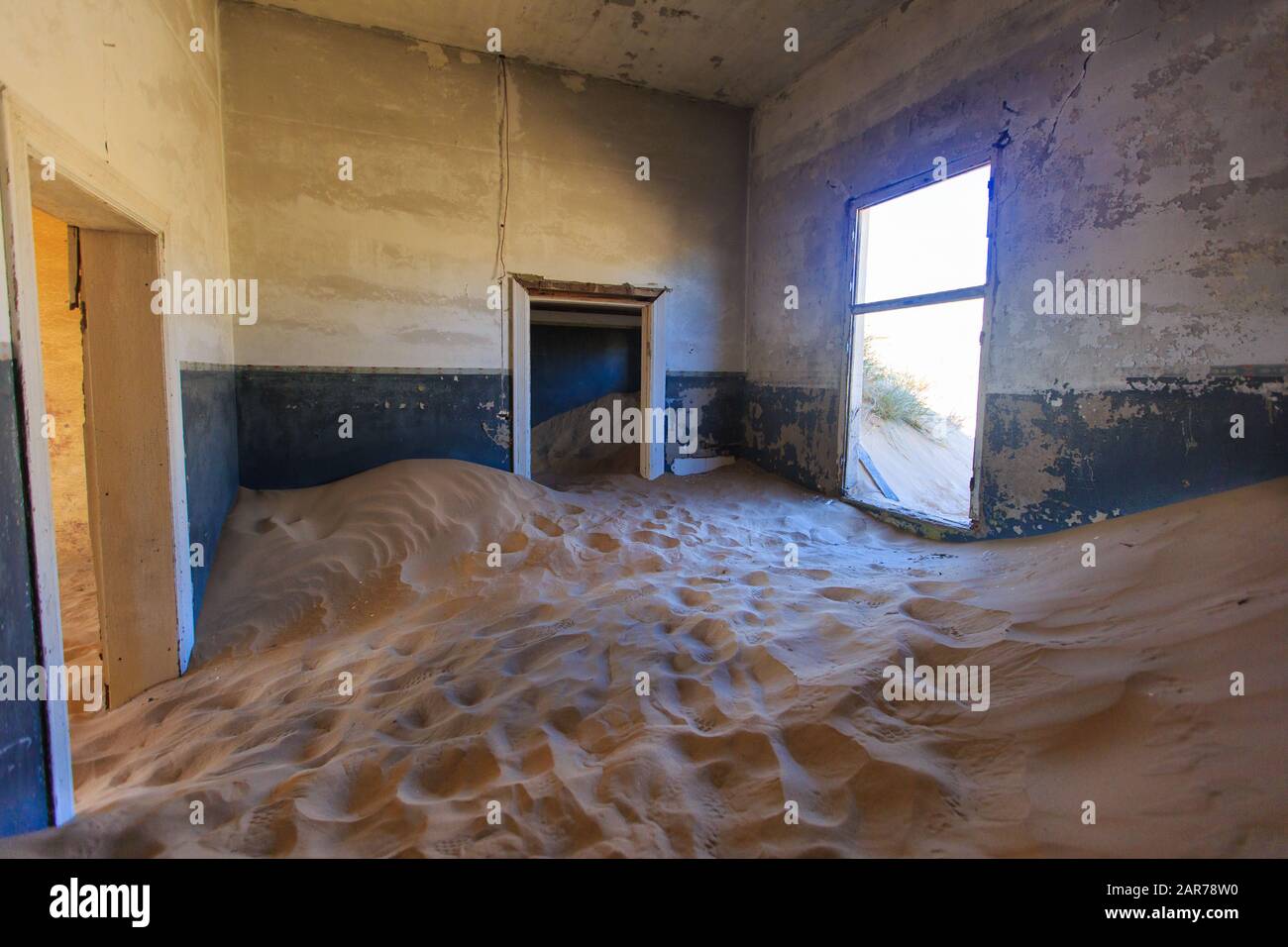 Abandoned and forgotten building and room being taken over by encroaching sandstorm, Kolmanskop ...