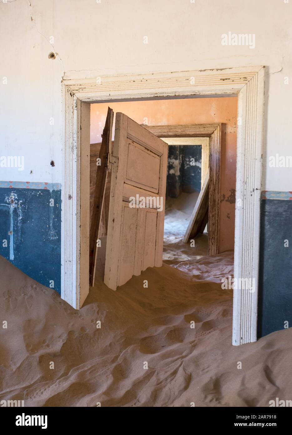 Abandoned and forgotten building and room being taken over by encroaching sandstorm, Kolmanskop ...