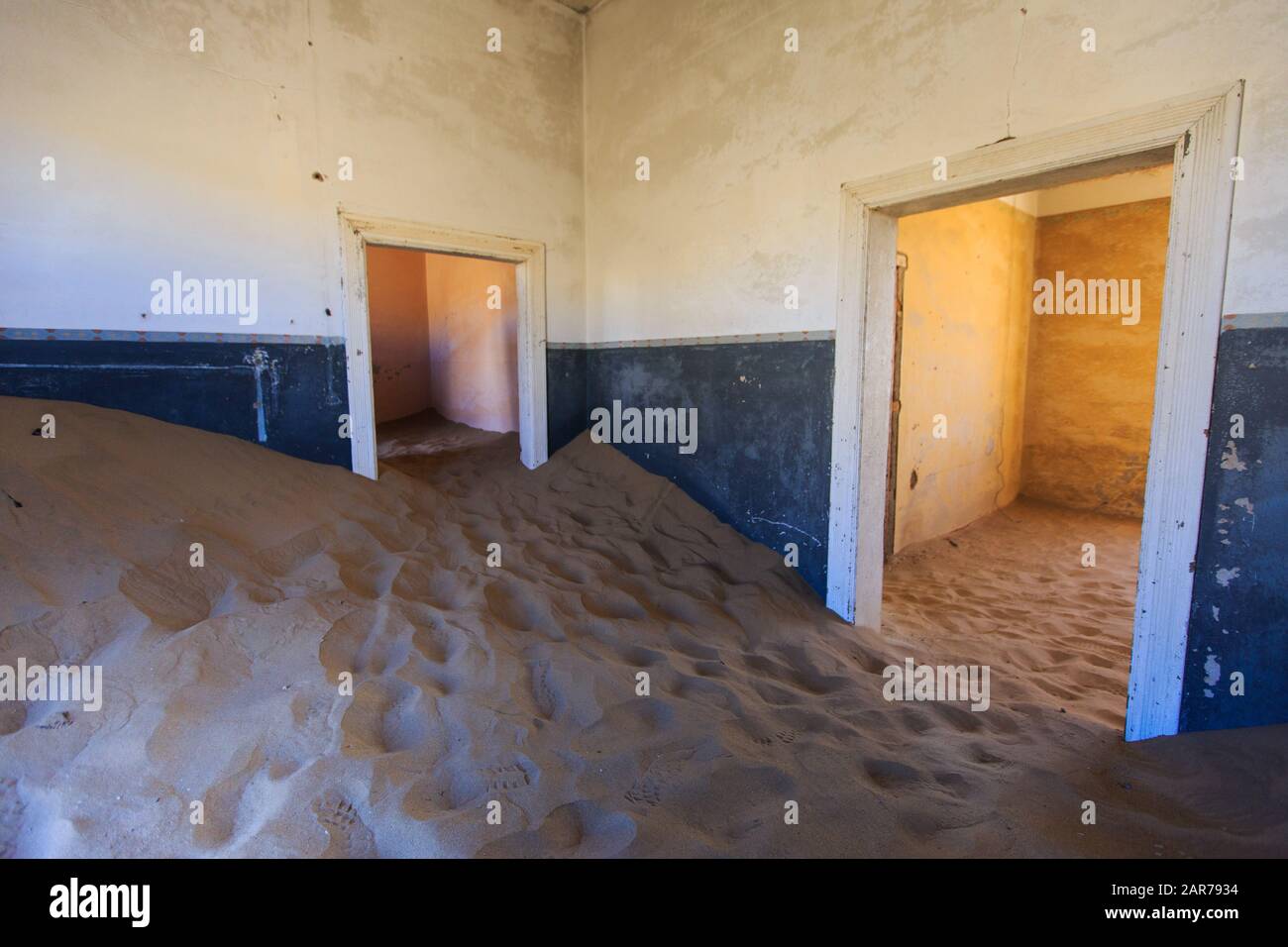 Abandoned and forgotten building and room being taken over by encroaching sandstorm, Kolmanskop ...