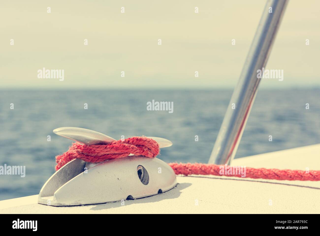 Sailboat deck with stacked red rope while sailing Stock Photo - Alamy