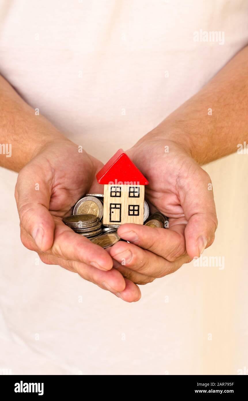 house on male hand image Stock Photo - Alamy