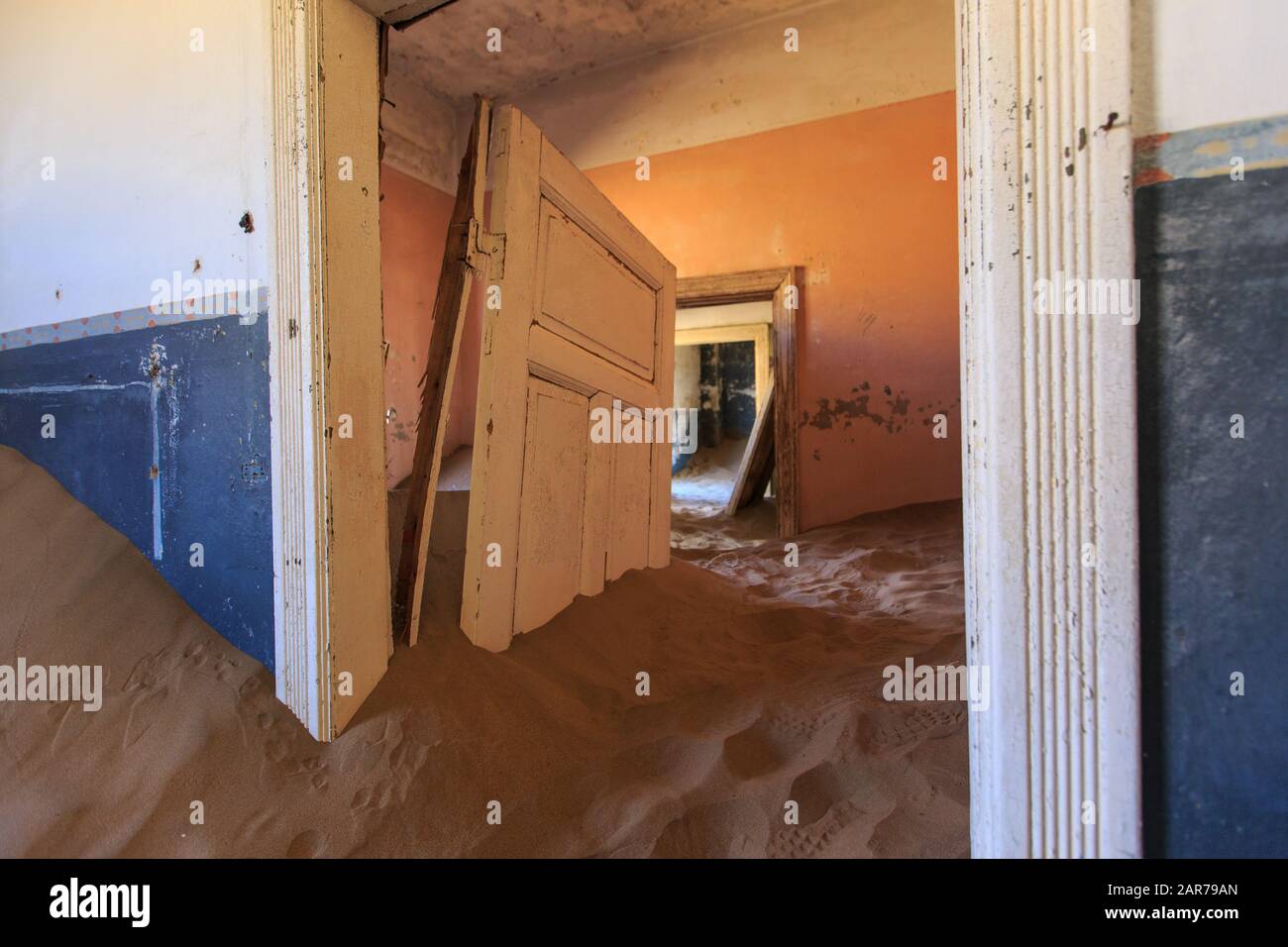 Abandoned and forgotten building and room being taken over by encroaching sandstorm, Kolmanskop ...