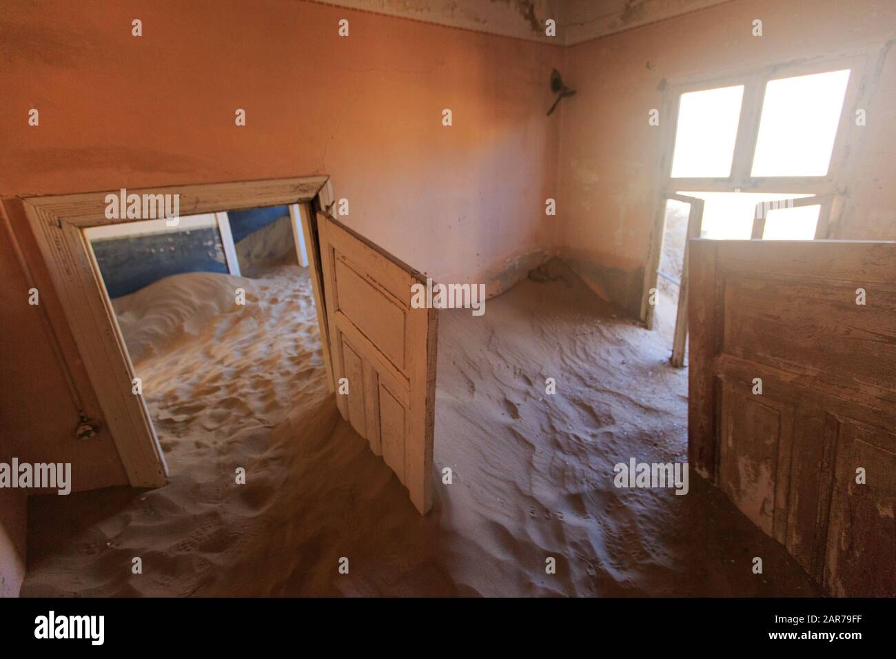 Abandoned and forgotten building and room being taken over by encroaching sandstorm, Kolmanskop ...