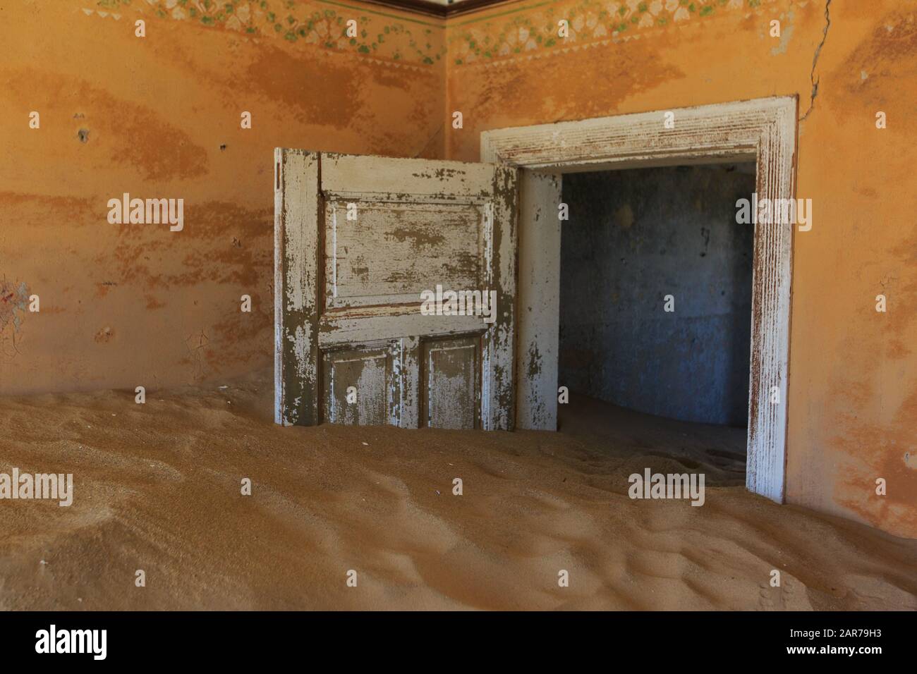 Abandoned and forgotten building and room being taken over by encroaching sandstorm, Kolmanskop ...