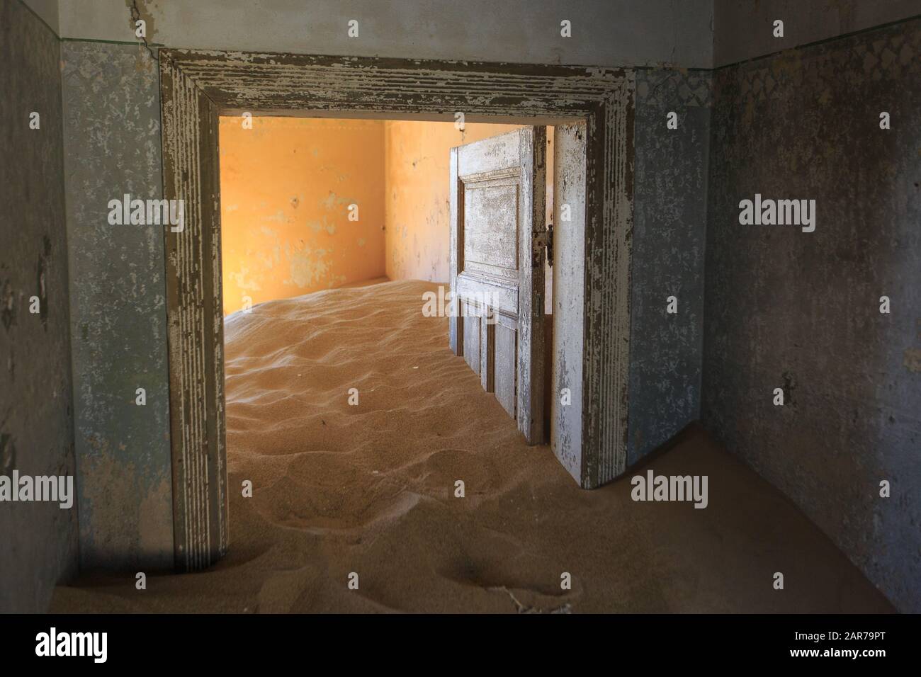 Abandoned and forgotten building and room being taken over by encroaching sandstorm, Kolmanskop ...