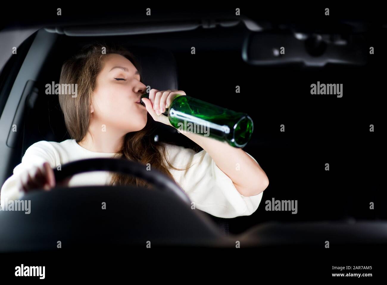 Drunk woman driving car beer hi-res stock photography and images - Alamy