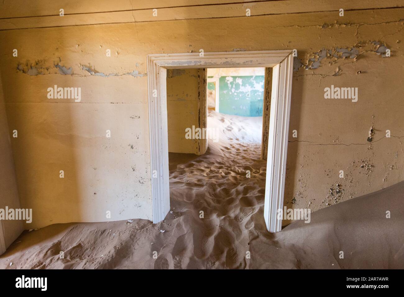 Abandoned and forgotten building and room being taken over by encroaching sandstorm, Kolmanskop ...