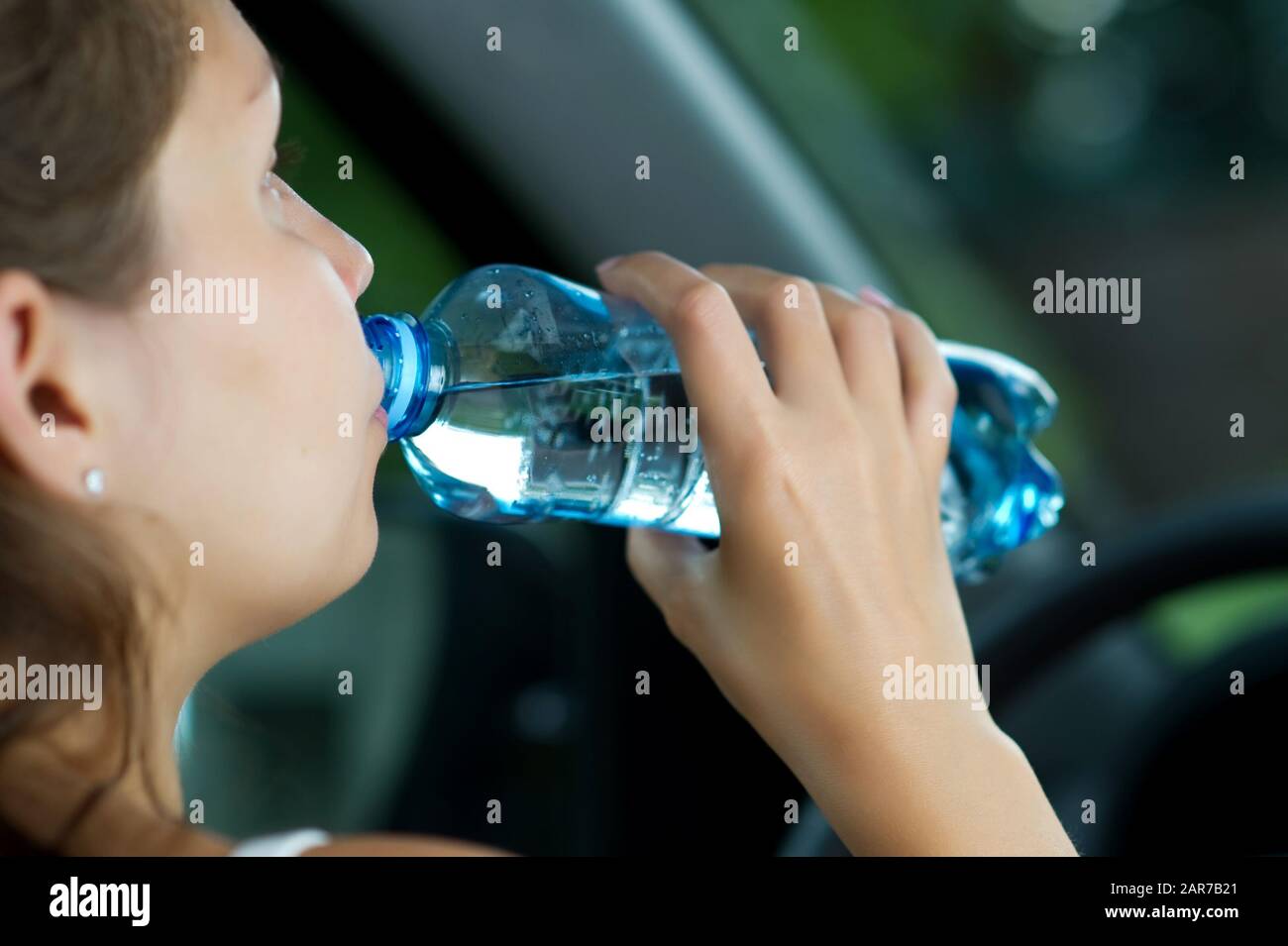 Driver drinking from water bottle hi-res stock photography and images ...