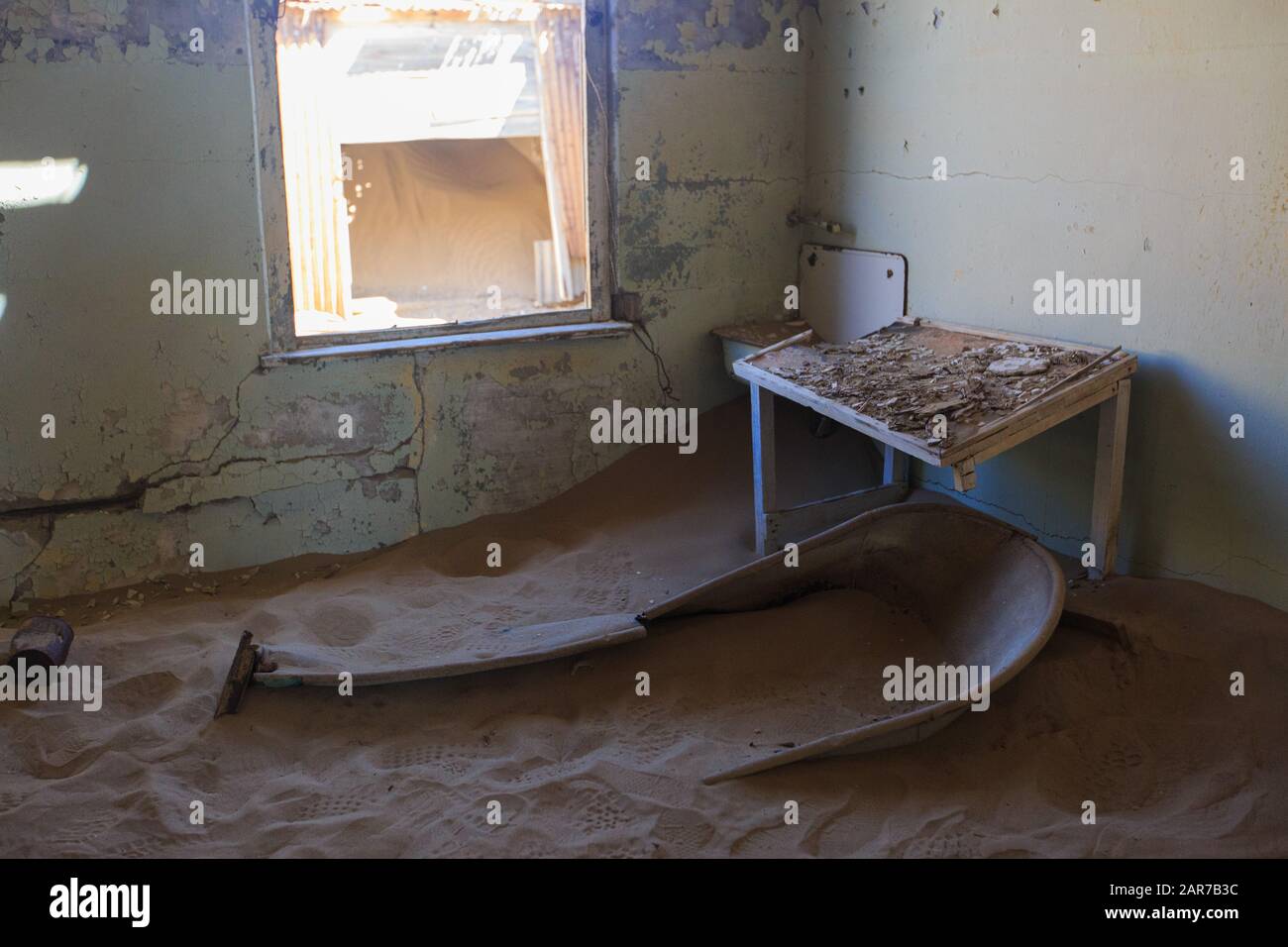 Abandoned and forgotten building and room being taken over by encroaching sandstorm, Kolmanskop ...
