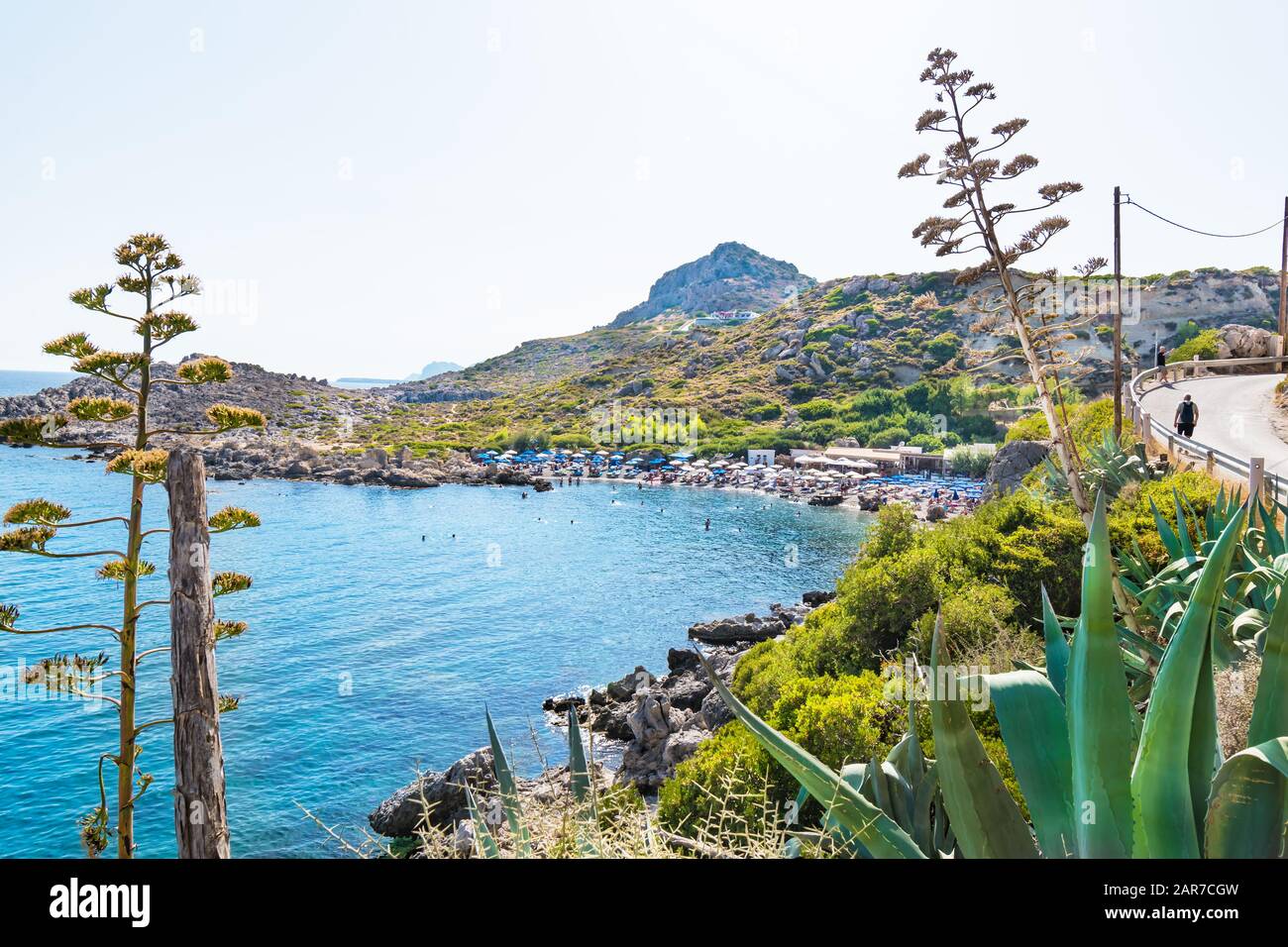 View of Ladiko beach with sun beds and sun shades (Rhodes, Greece Stock ...