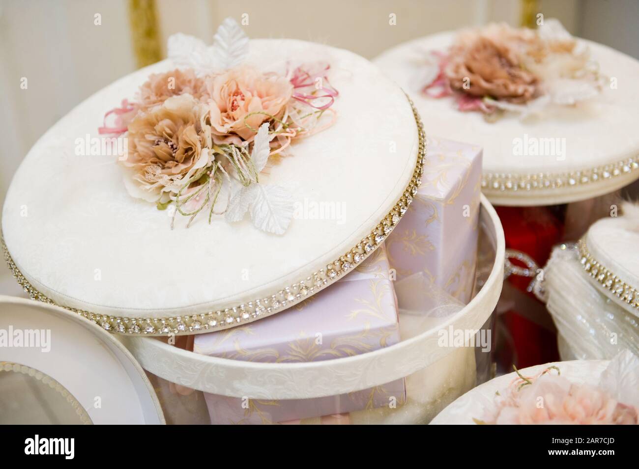 large bright round gift boxes with transparent walls with slightly open ...