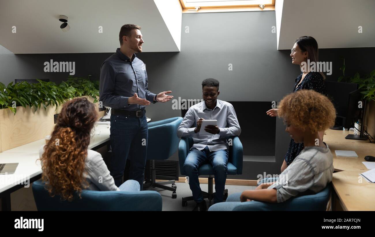 Male team leader hold teambuilding meeting in coworking space Stock ...
