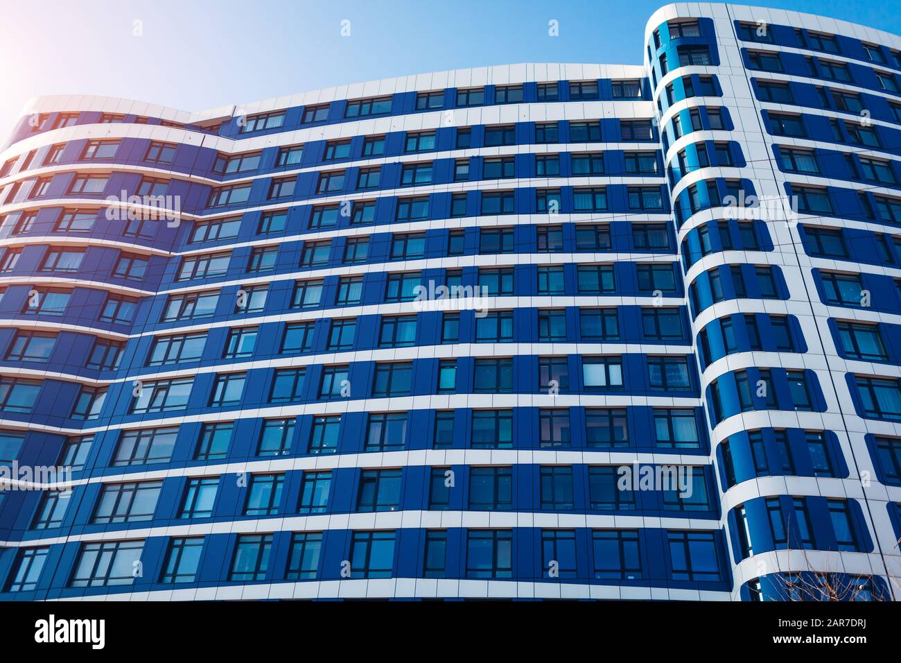 New multistorey residential round building. Modern house of blue and ...