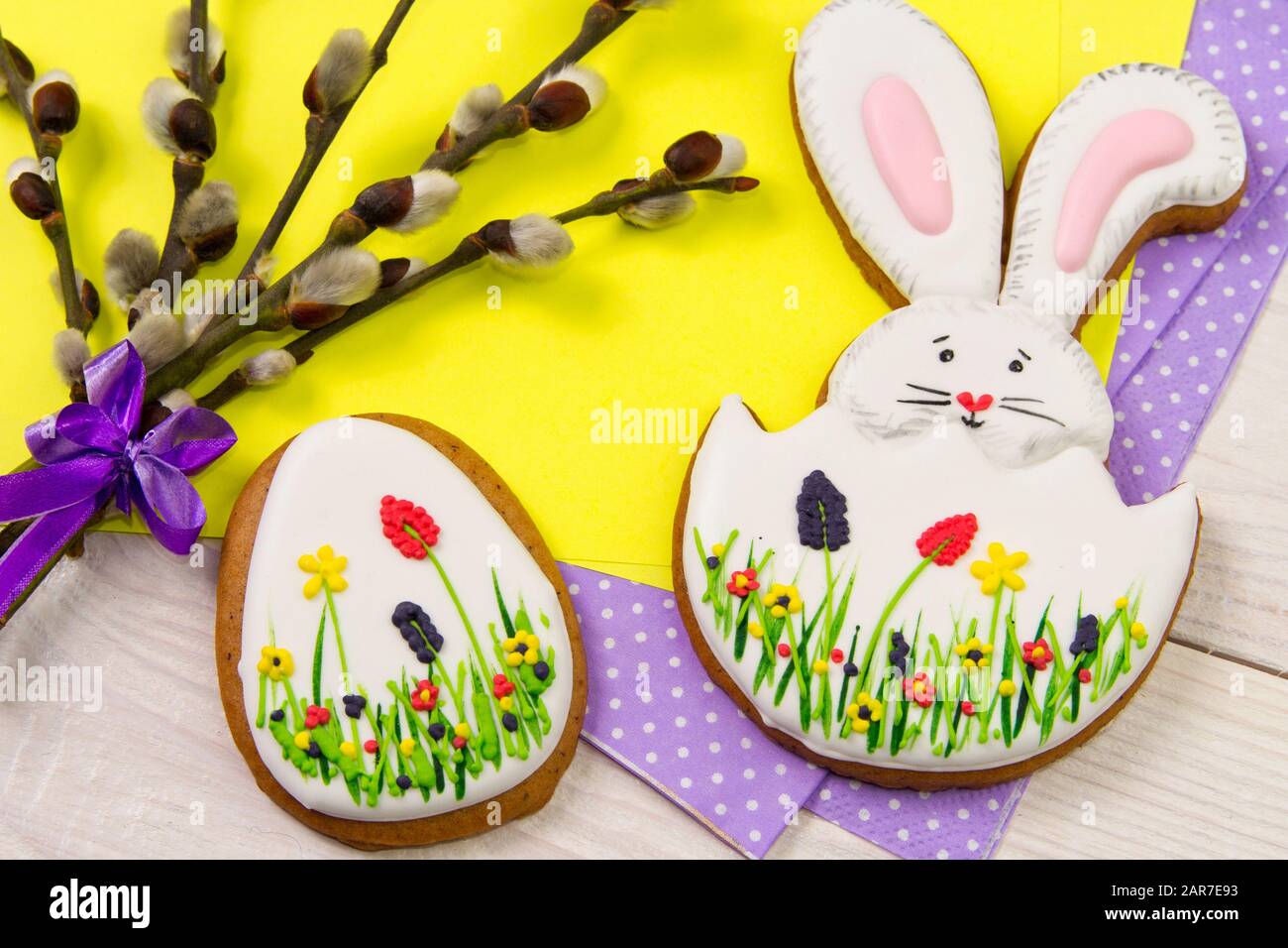 Gingerbread Easter Bunny and eggs with a willow twig on yellow and ...