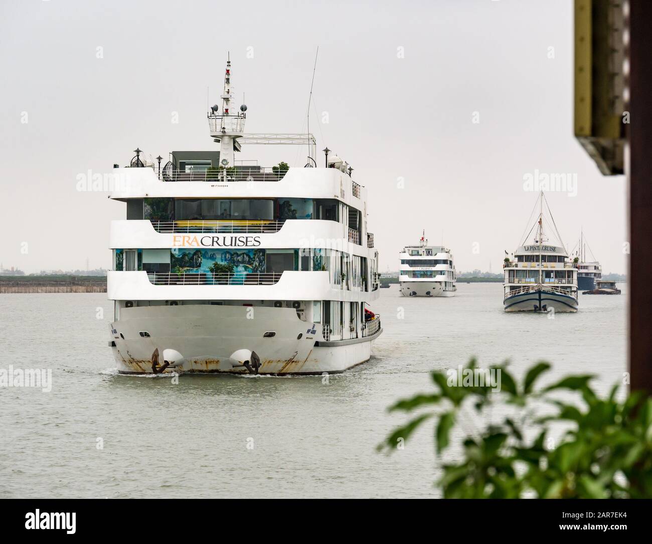 Convoy of tourist cruise ships with Era Cruises boat, Halong Bay ...