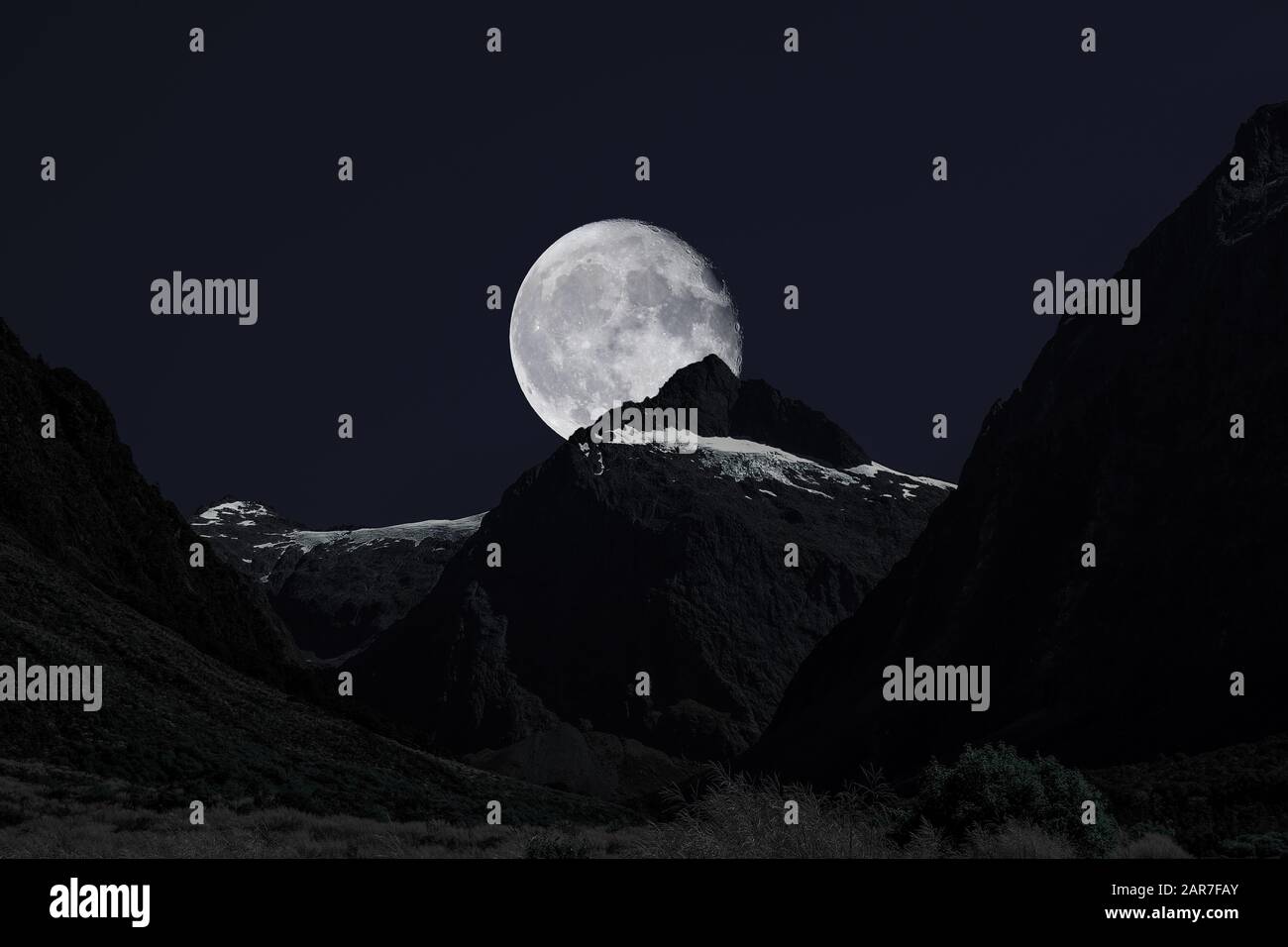 Science fiction Moon rise over mountains Stock Photo - Alamy