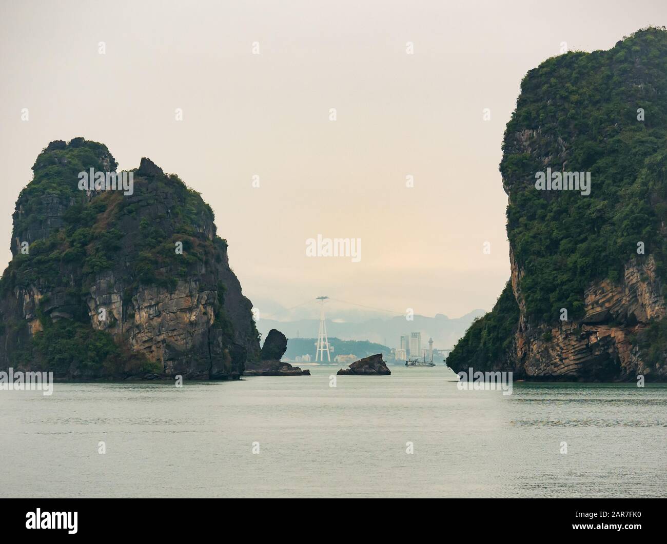 Limestone karst cliff rock formation sea stacks with Lach Huyen Port ...